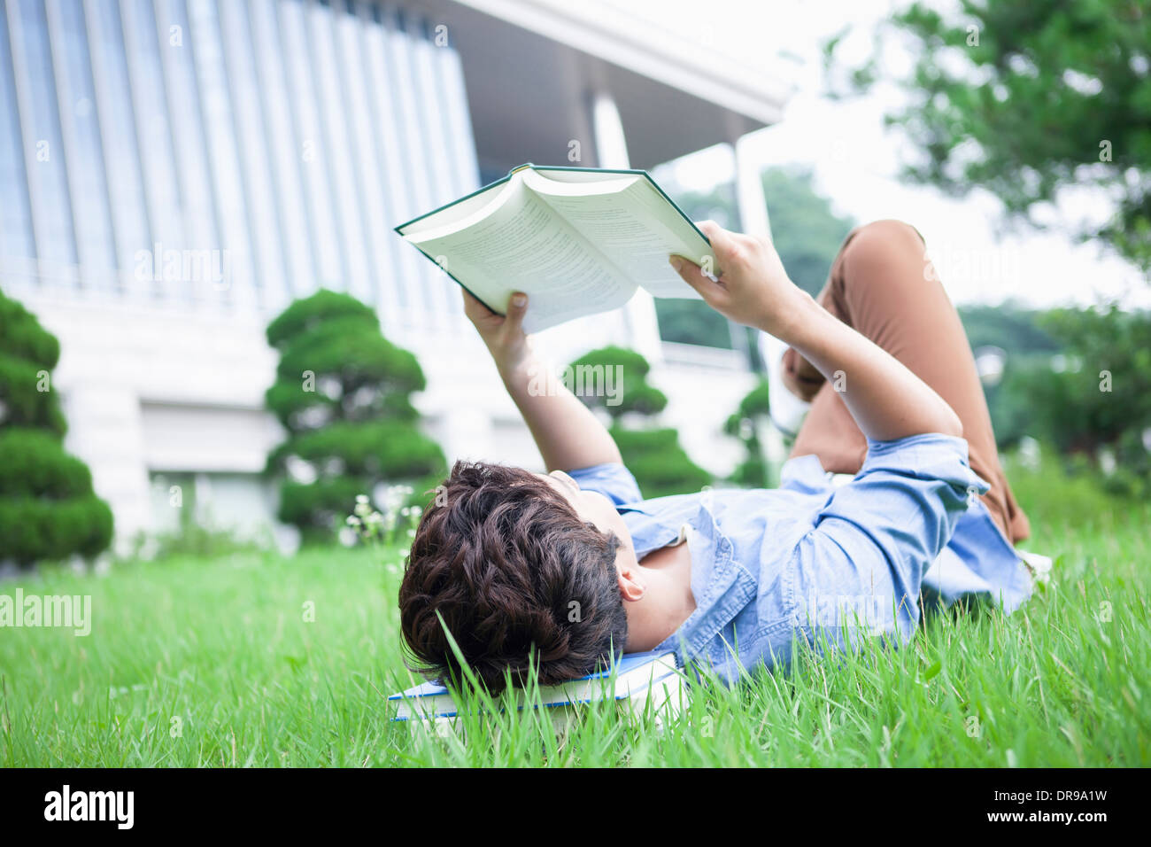 Reclining man reading hi-res stock photography and images - Alamy