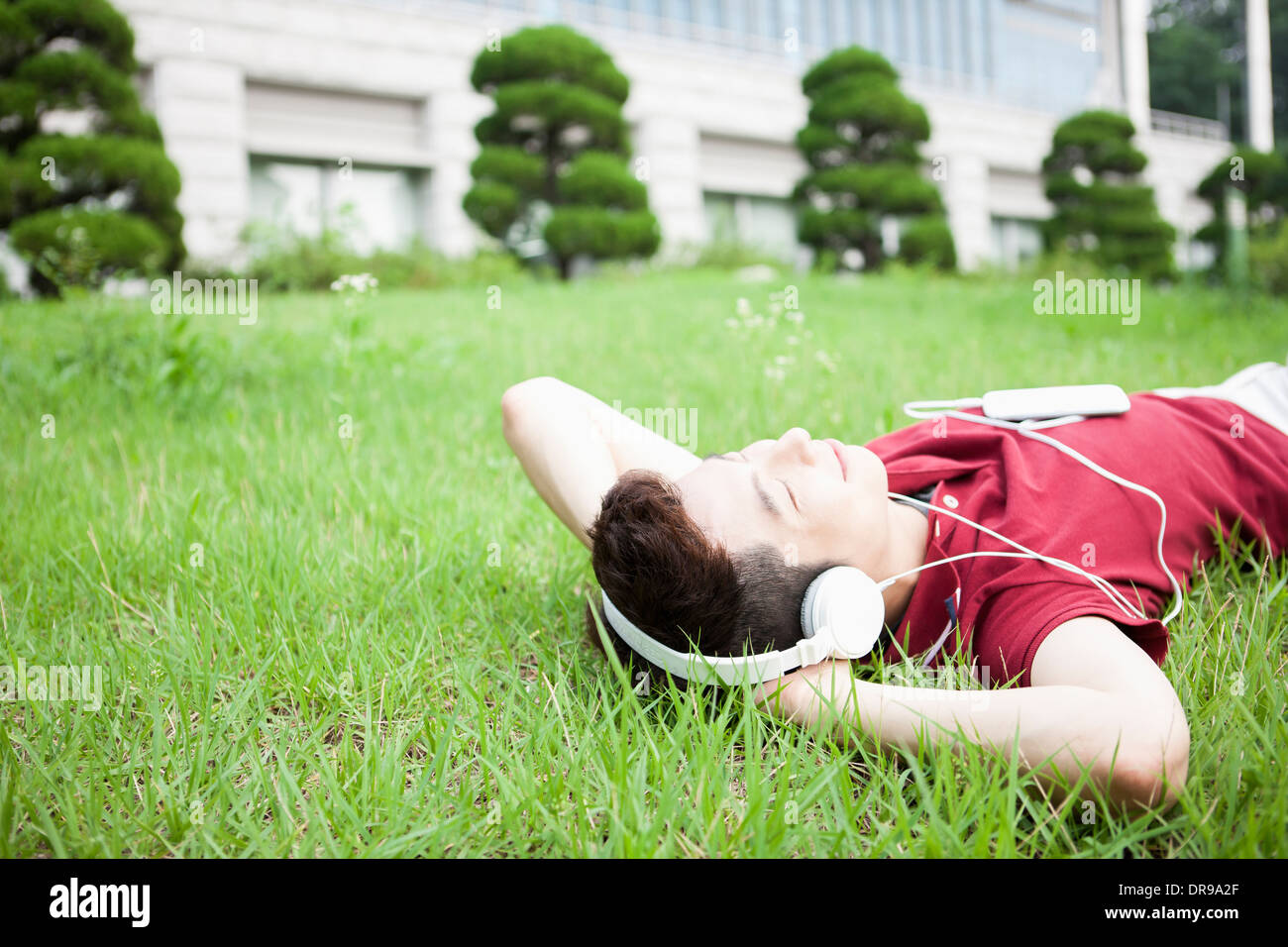Man lying down laughing hi-res stock photography and images - Alamy