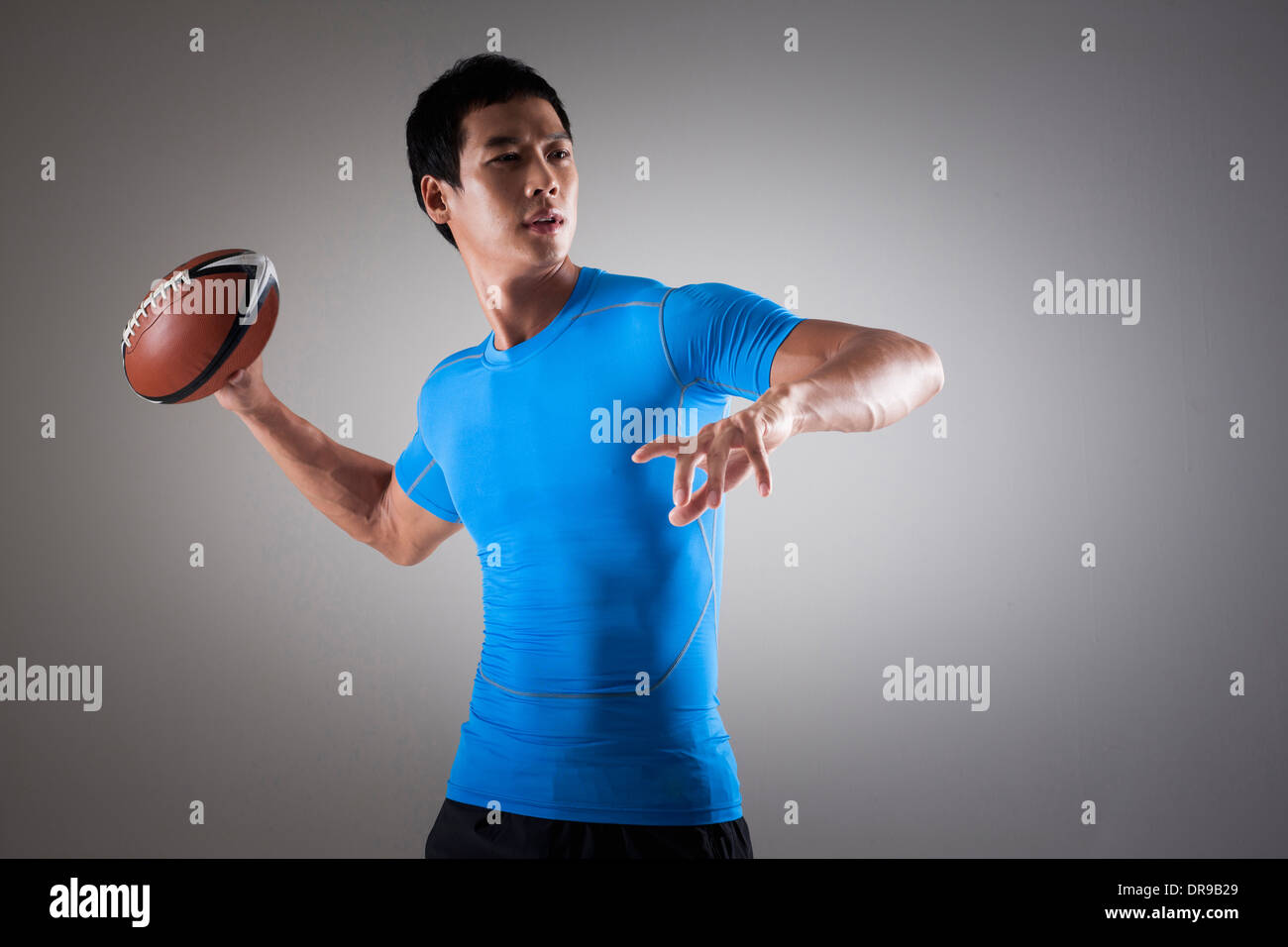 Man throwing rugby ball hi-res stock photography and images - Alamy