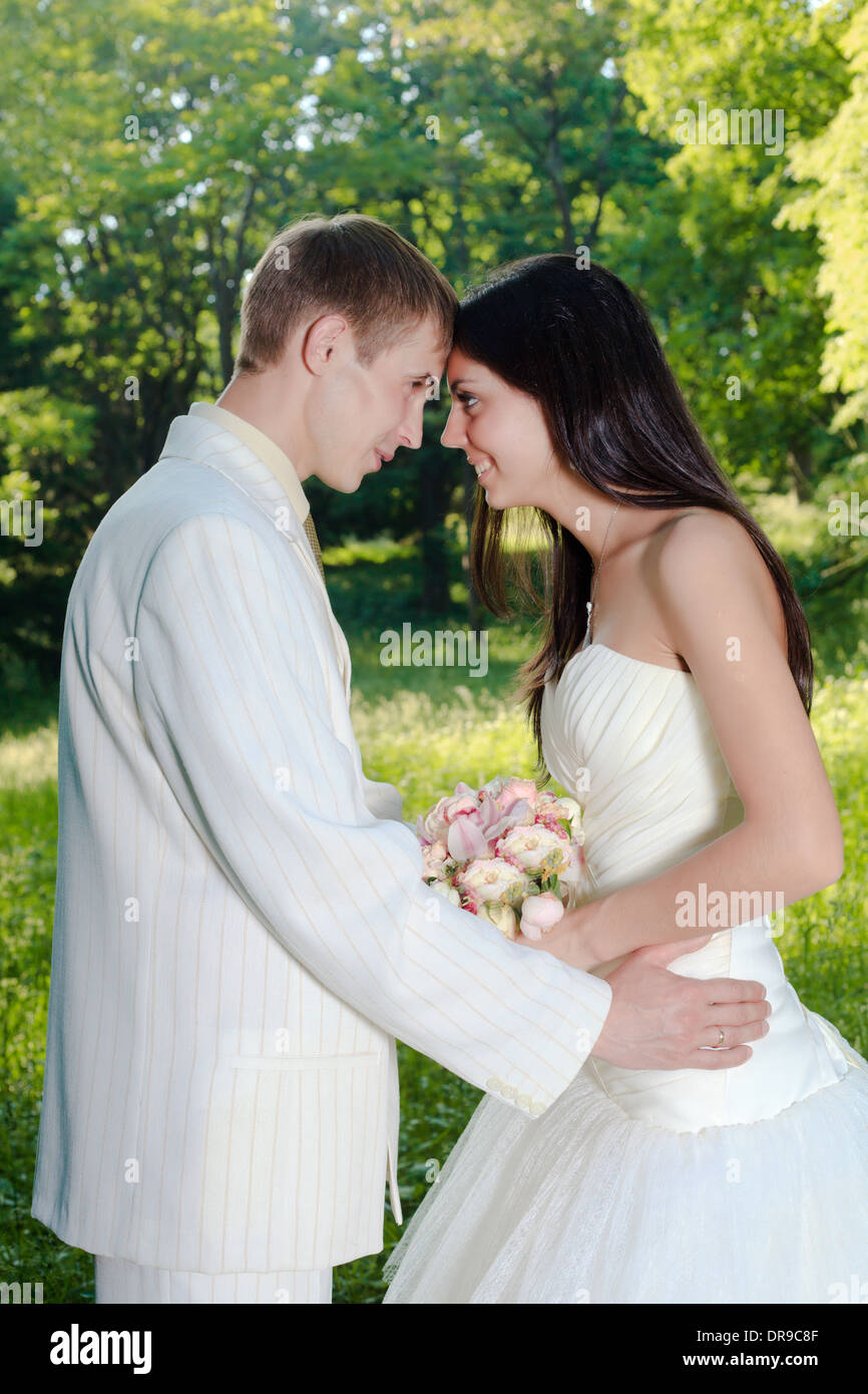 Wedding couple are smiling outdoor Stock Photo - Alamy