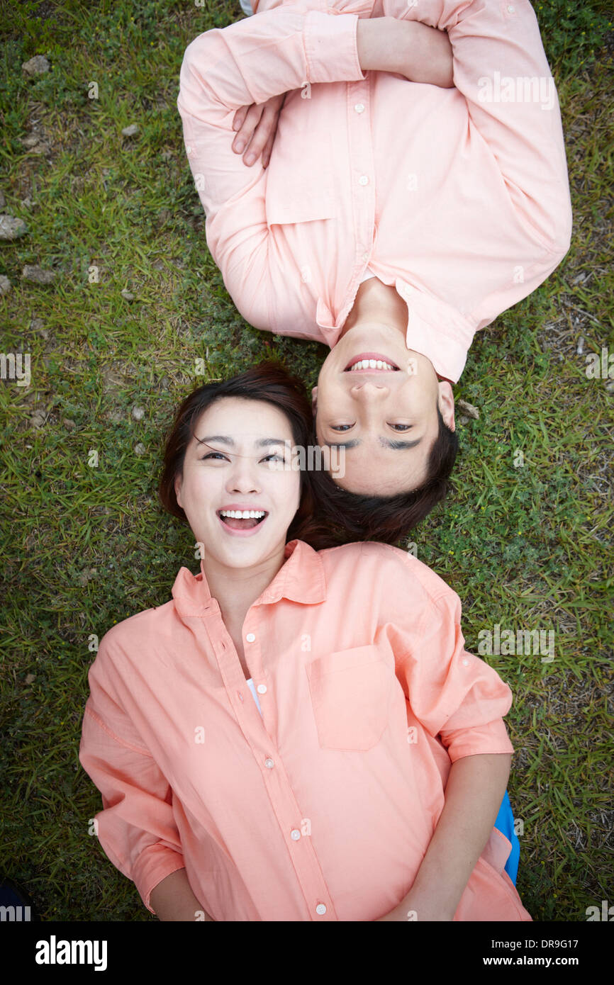 Couple grass looking up hi-res stock photography and images - Alamy