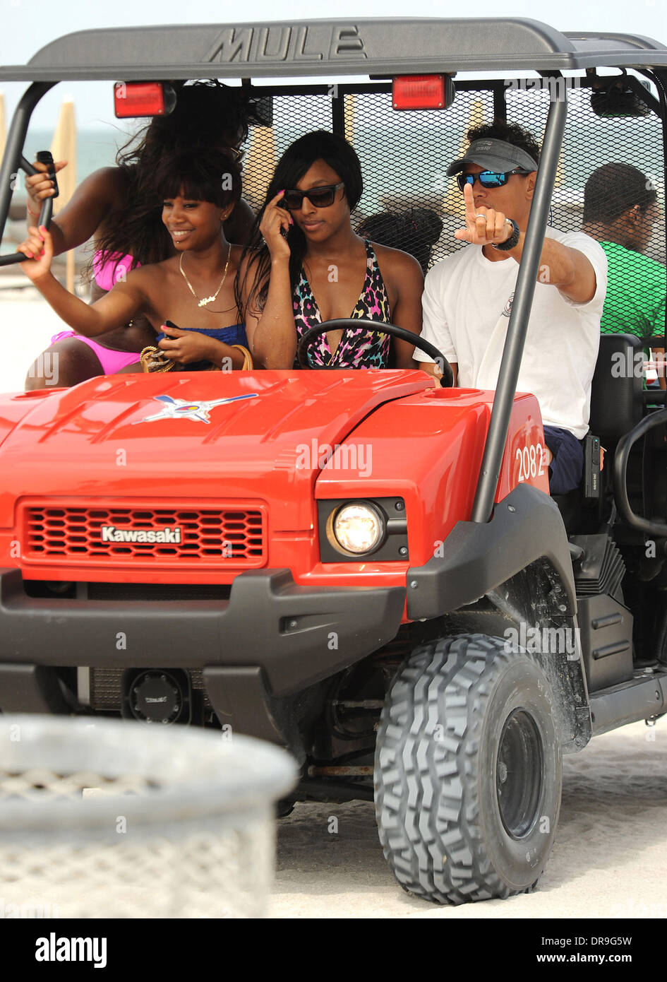 Alexandra Burke hitches a ride on the Ocean Rescue buggy at Miami Beach ...