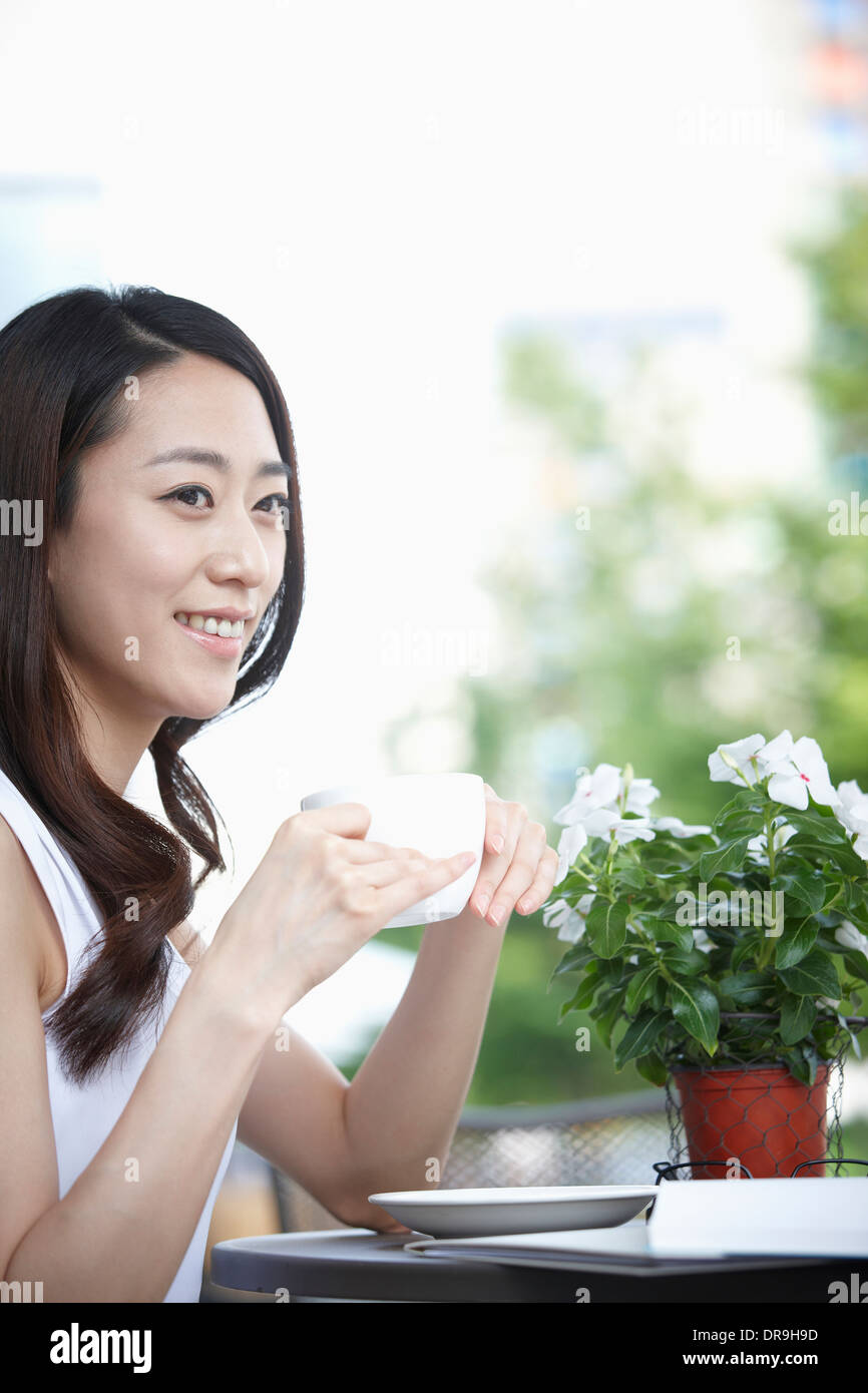 a woman drinking coffee Stock Photo - Alamy