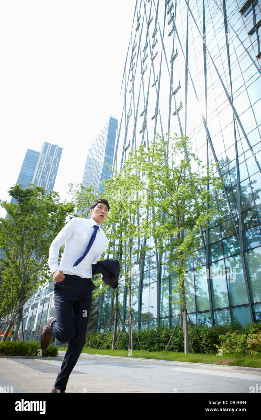 a business man running on the street Stock Photo - Alamy