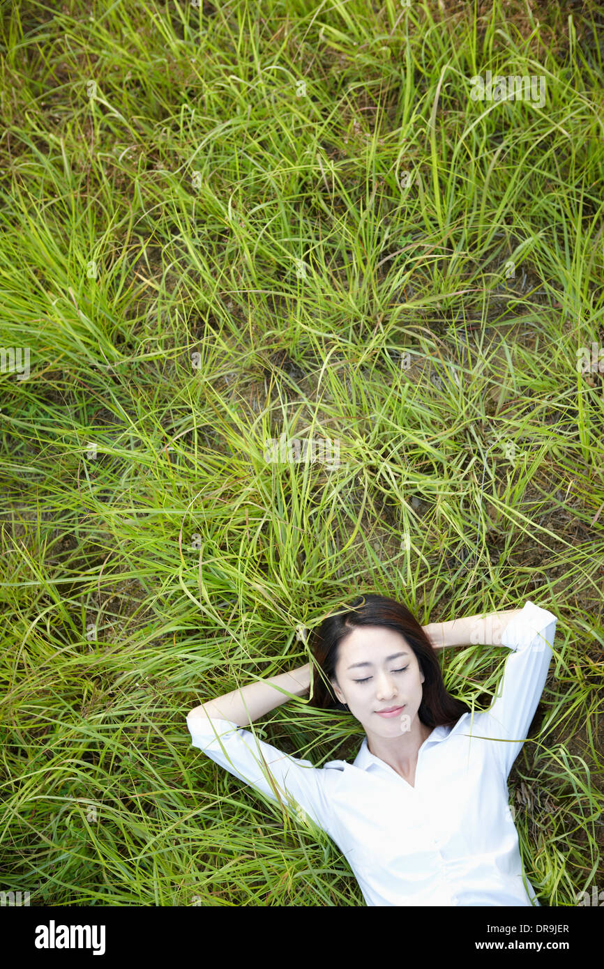 You hands behind head grass hi-res stock photography and images - Alamy