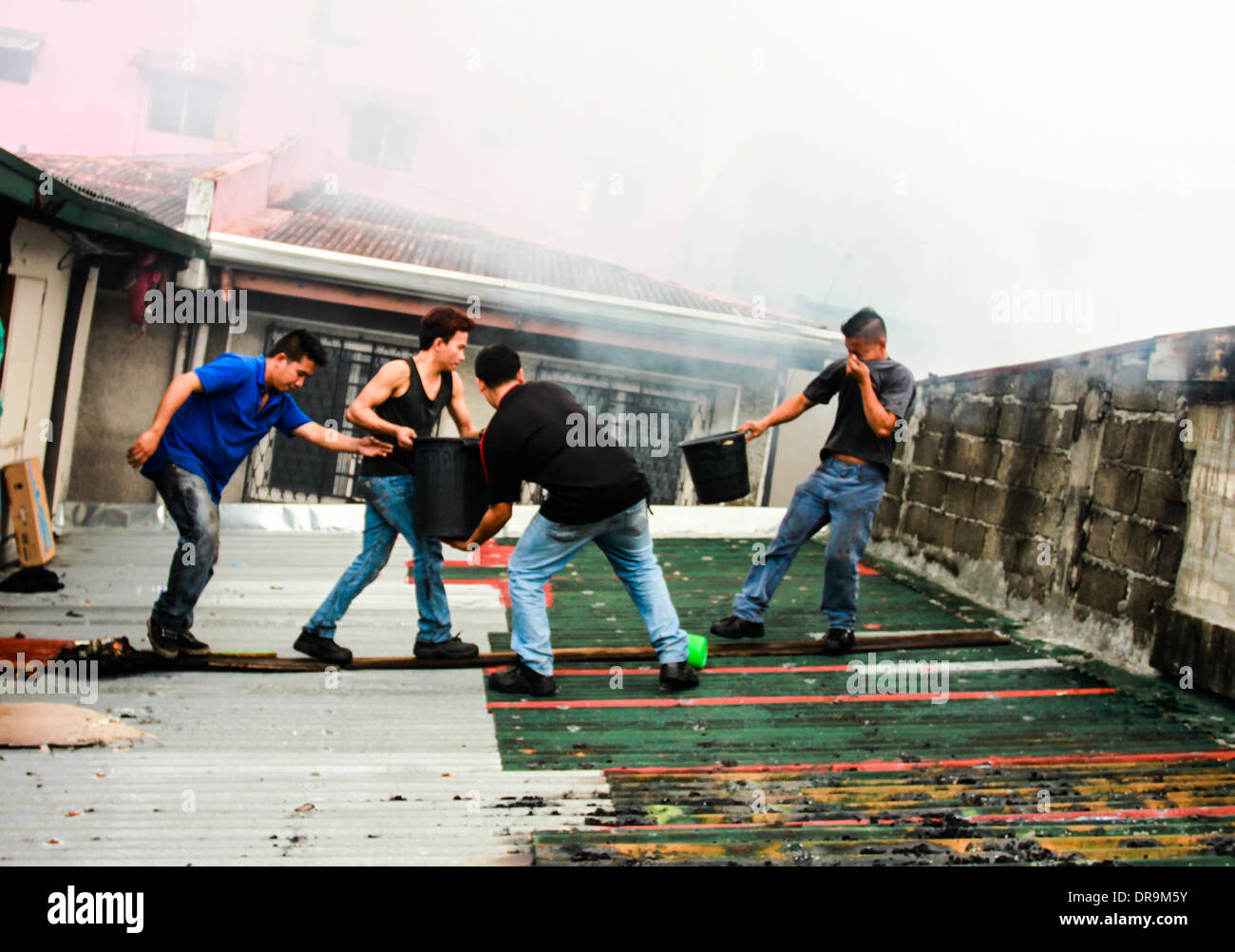 Pasay City, Philippines-January 22, 2014: Residents in a roof top ...
