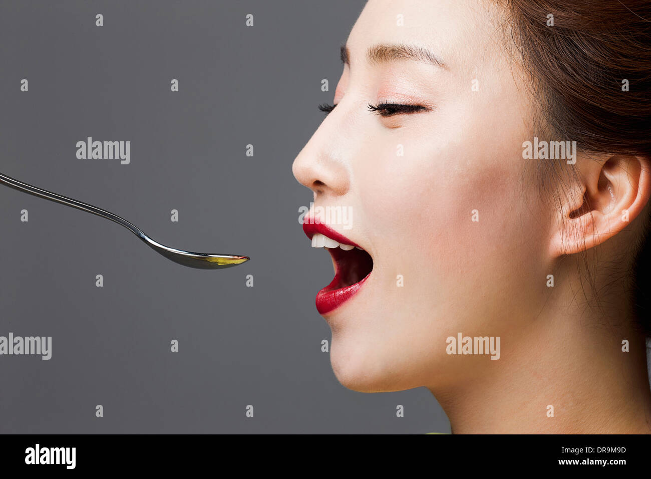 Woman spoon mouth cut out hi-res stock photography and images - Alamy