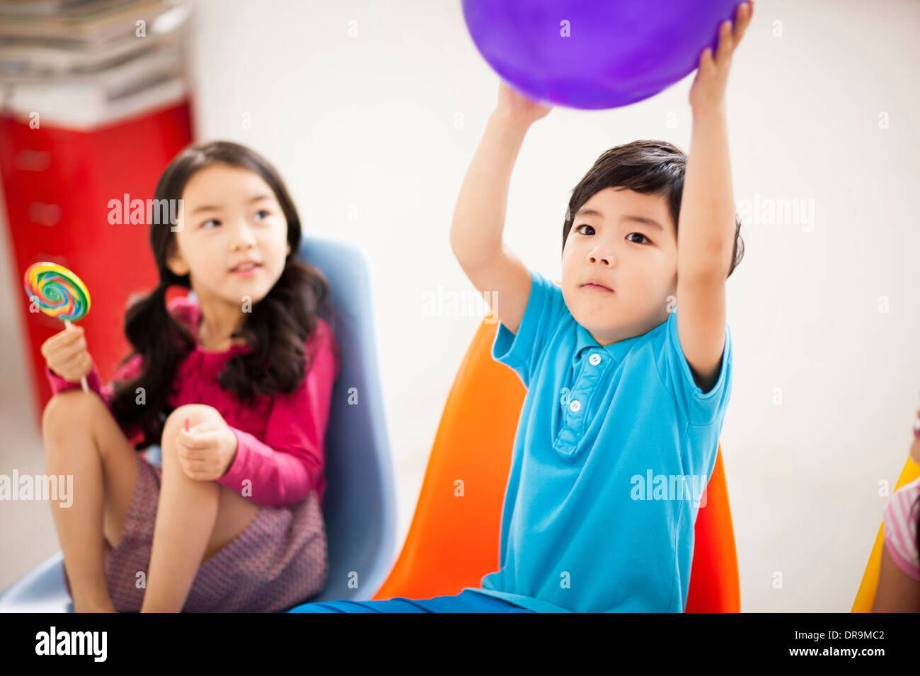 Children with balloon hi-res stock photography and images - Alamy