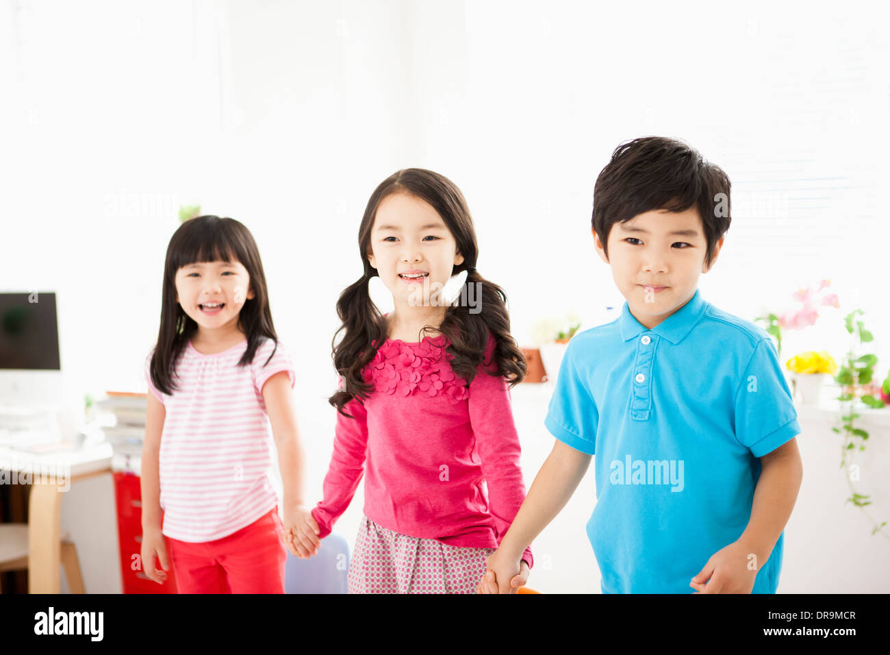 kids standing on chairs Stock Photo - Alamy