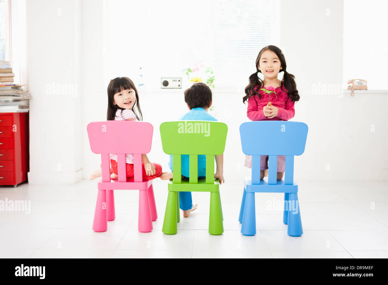 Woman kneeling behind man sitting hi-res stock photography and images ...