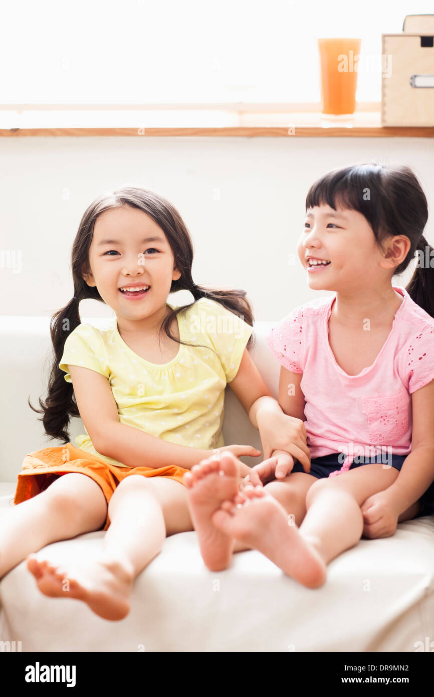 kids sitting on couch Stock Photo - Alamy
