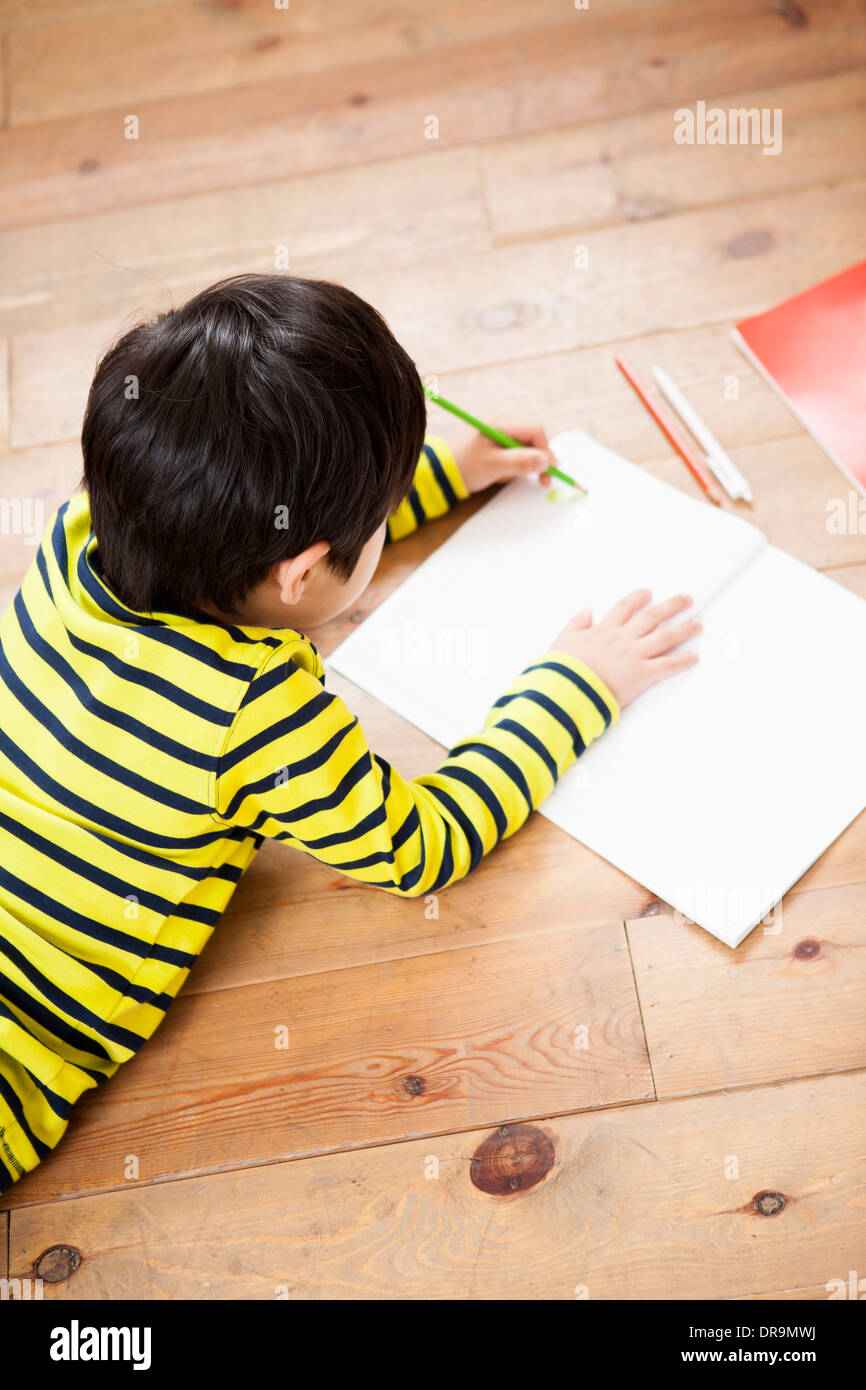 kids writing into a book Stock Photo - Alamy