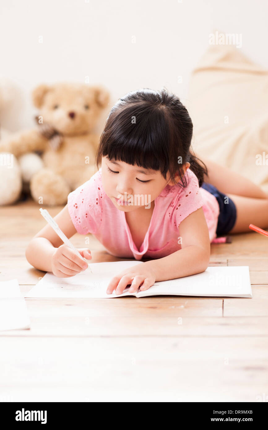 kids writing into a book Stock Photo - Alamy
