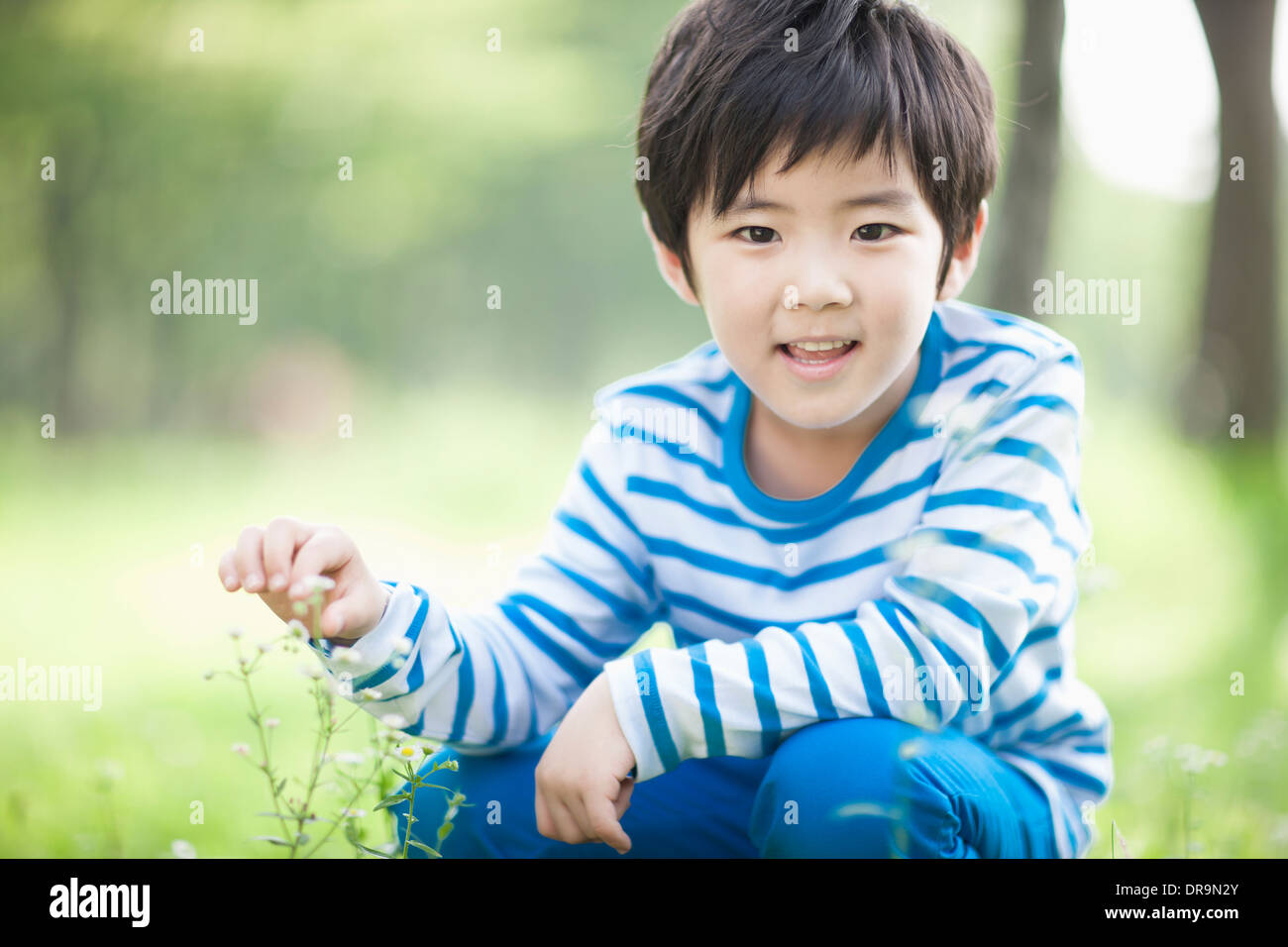 a boy exploring the nature Stock Photo - Alamy