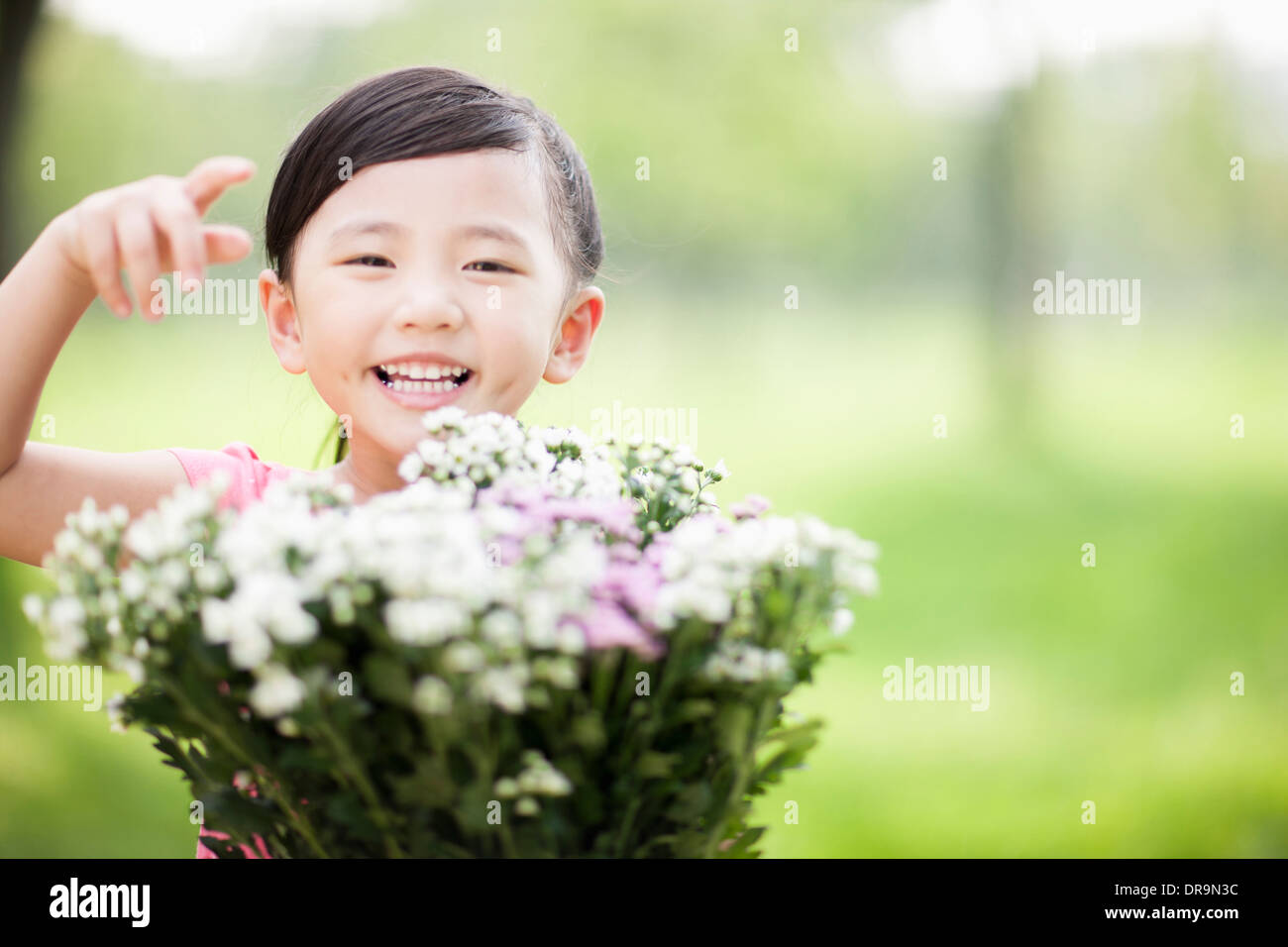 Girl holding bunch flowers hi-res stock photography and images - Alamy