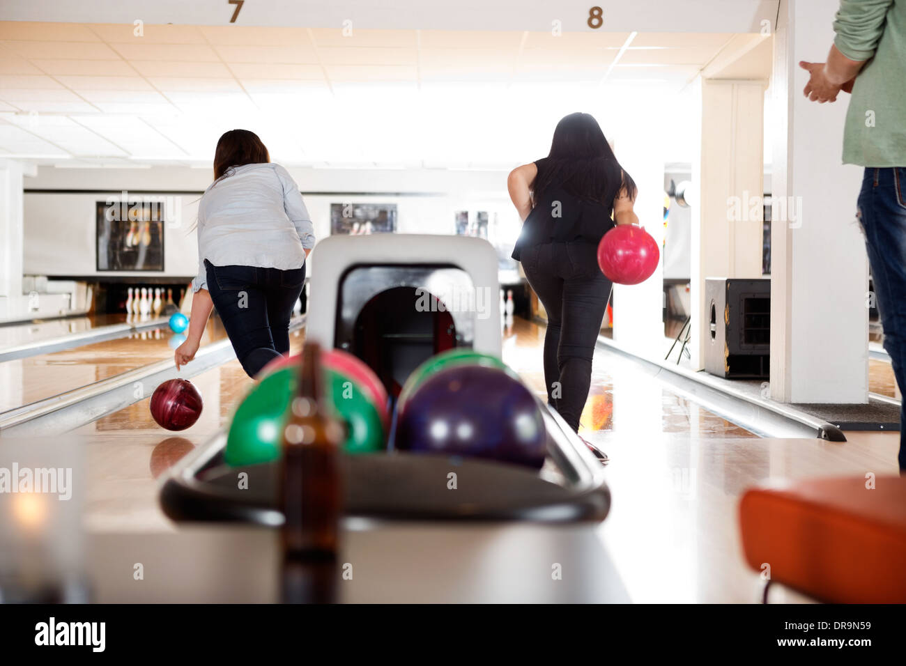 Women Playing in Bowling Alley Stock Photo - Alamy
