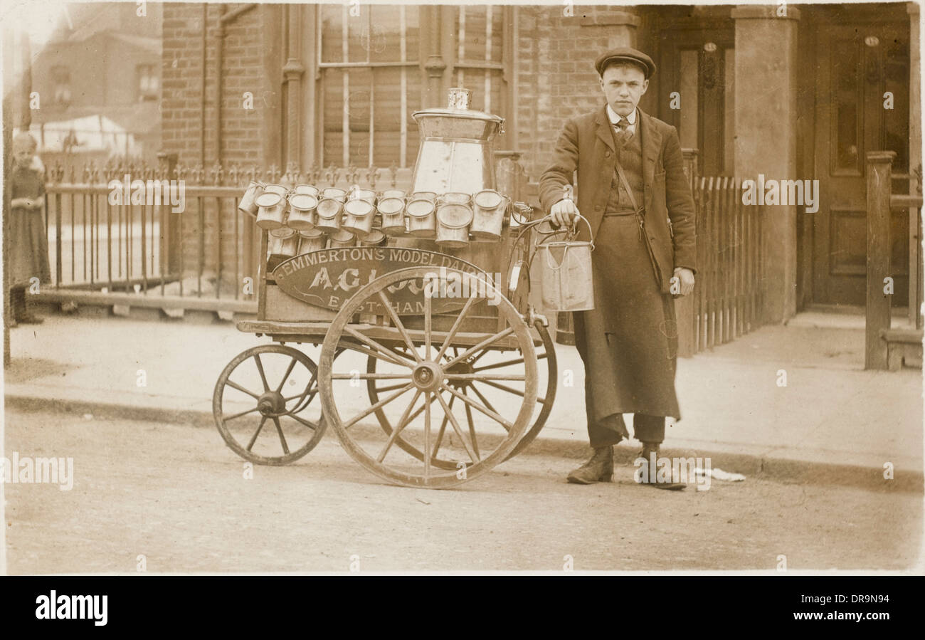 Milk boy with three-wheeled cart & cans Stock Photo - Alamy