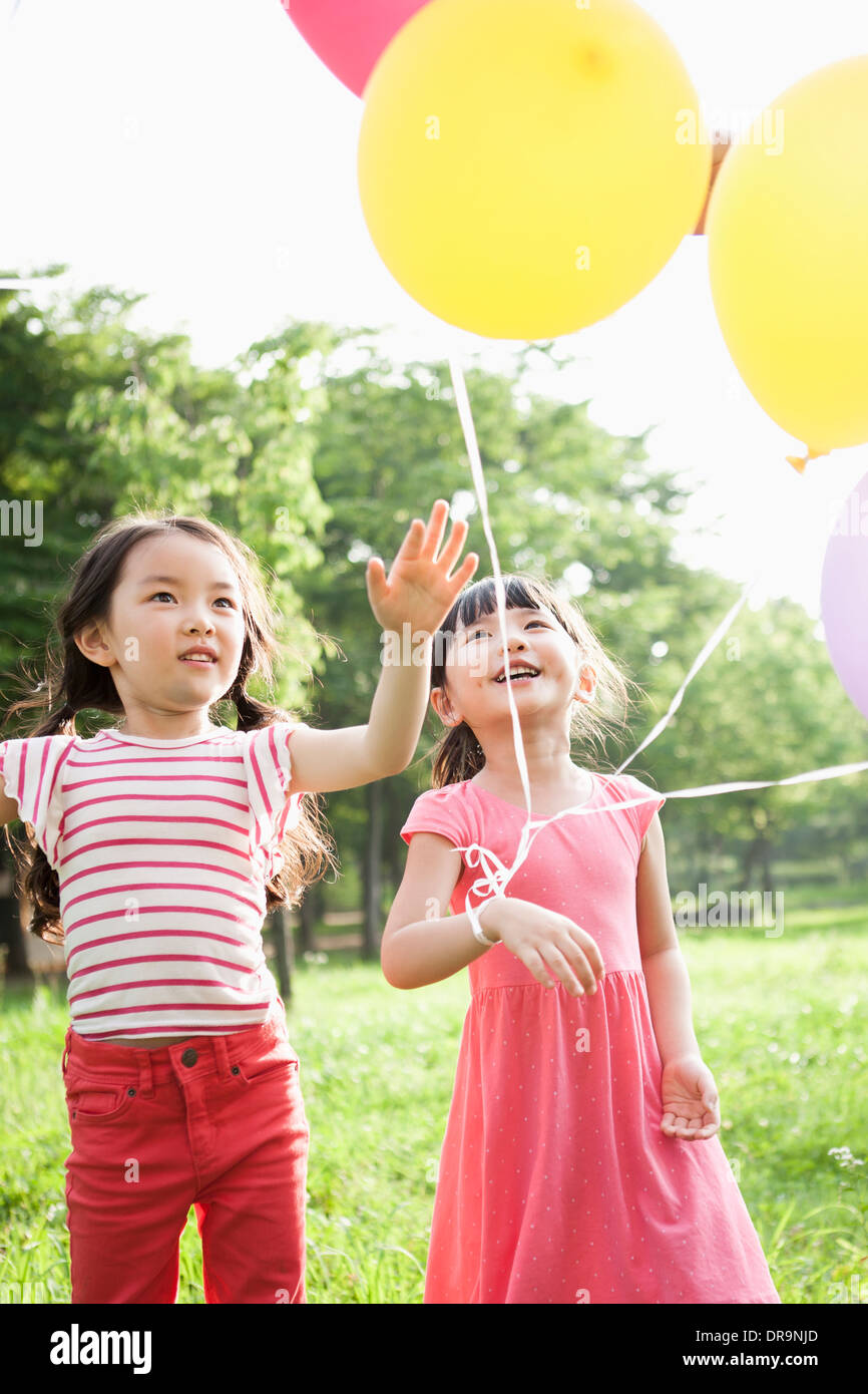 kids playing with balloons Stock Photo - Alamy