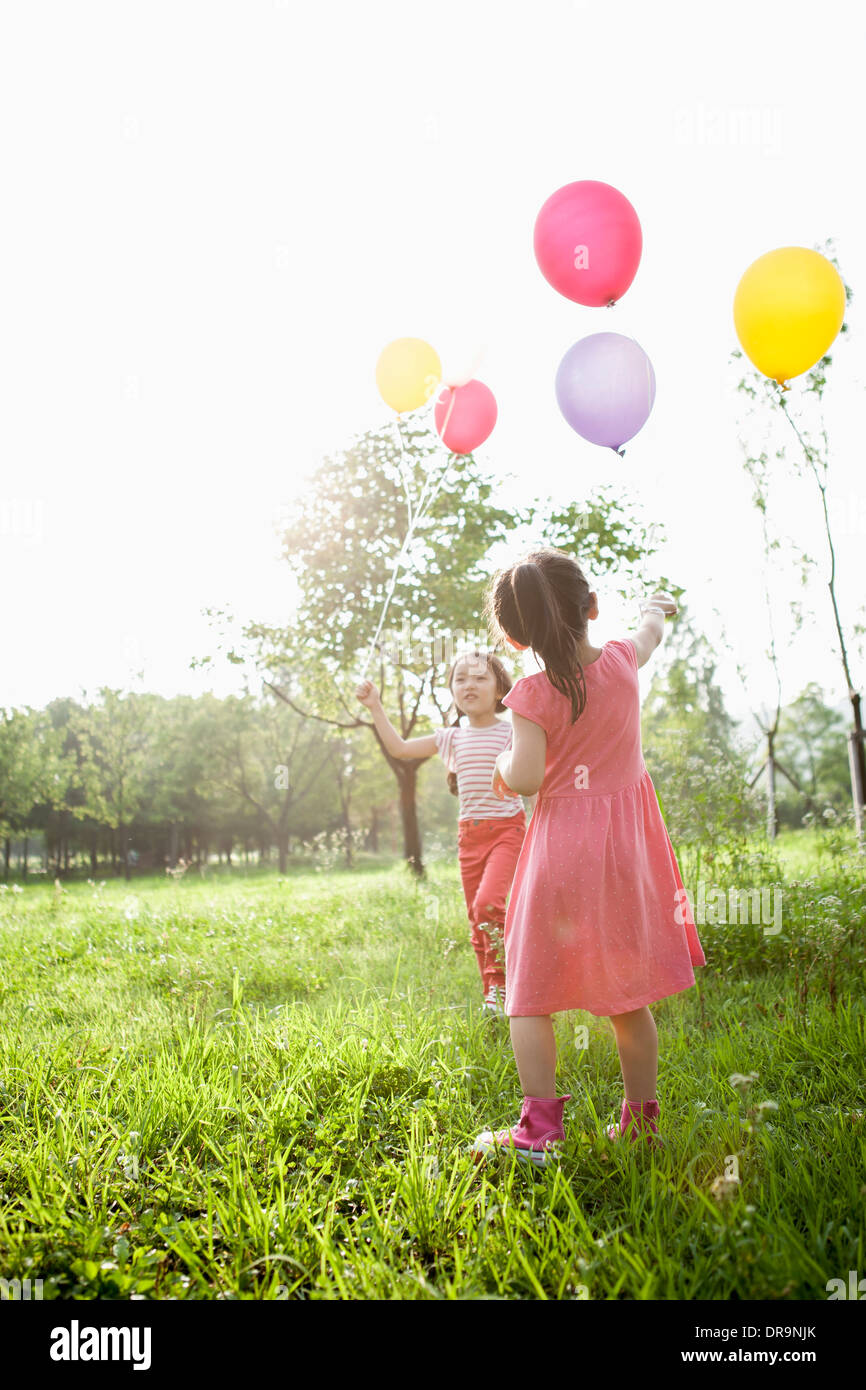 kids playing with balloons Stock Photo - Alamy