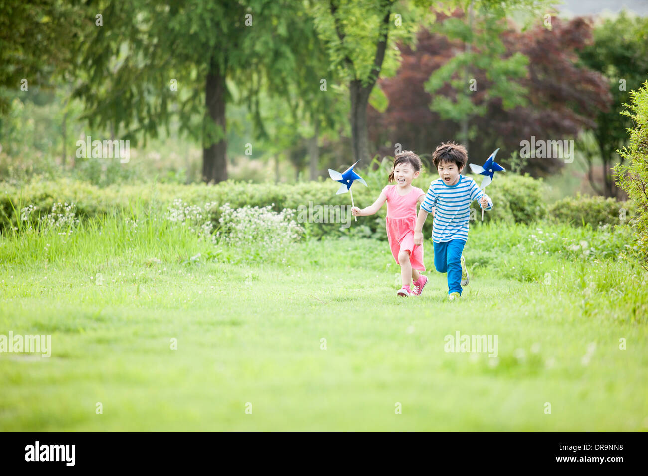 kids playing with a toy wind mills Stock Photo - Alamy
