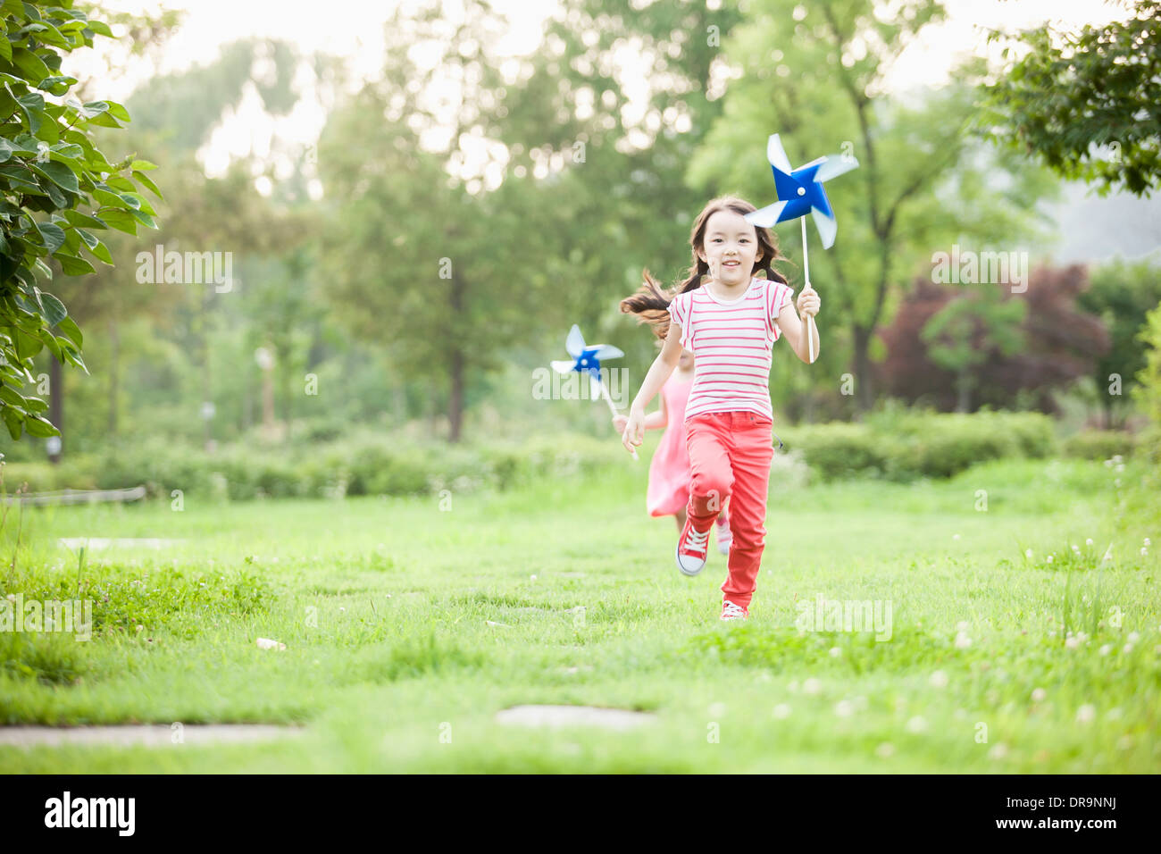 kids playing with a toy wind mills Stock Photo - Alamy