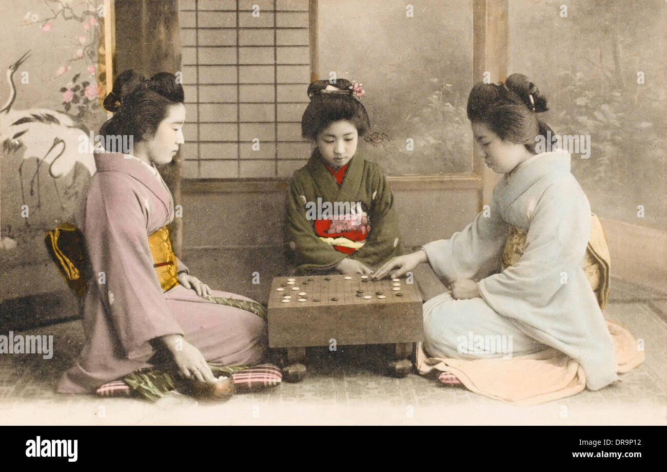 Three Japanese Geisha girls playing Go Stock Photo - Alamy
