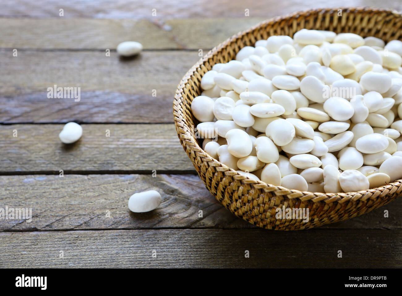 raw white beans in a basket, food closeup Stock Photo - Alamy