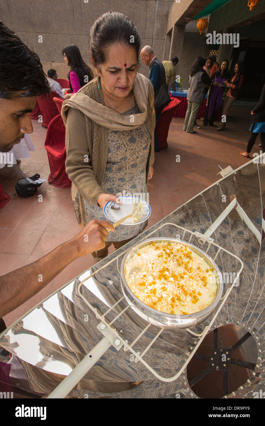 A solar cooker being used to cook food at the offices of WWF India, in ...