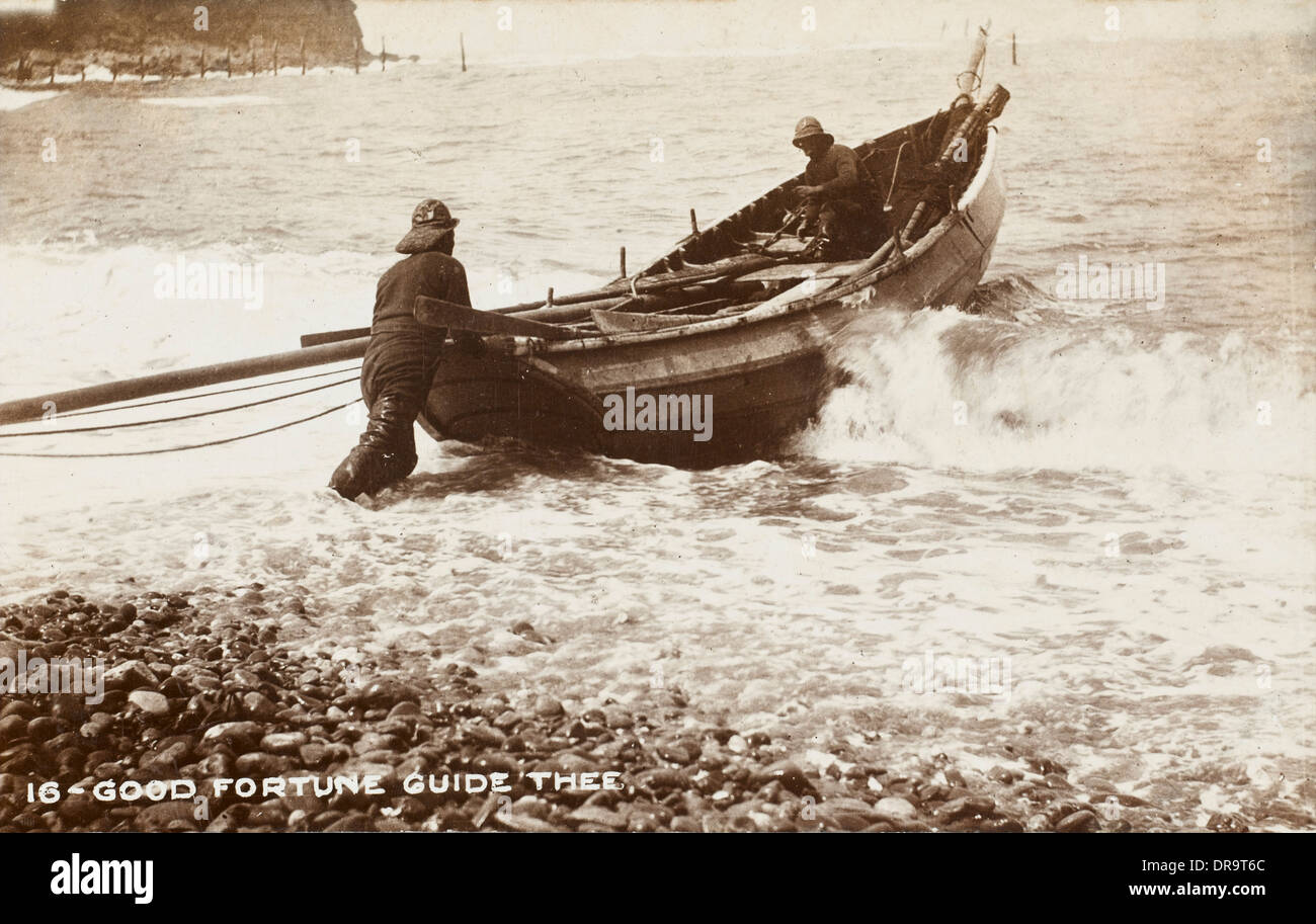 Fishermen pushing off from the shore Stock Photo - Alamy