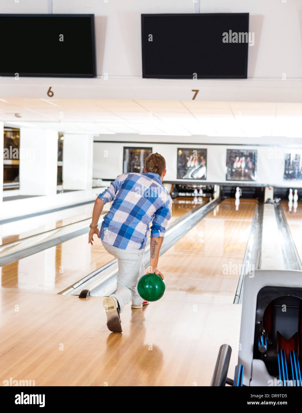 Man Going For The Last Pin in Bowling Alley Stock Photo - Alamy