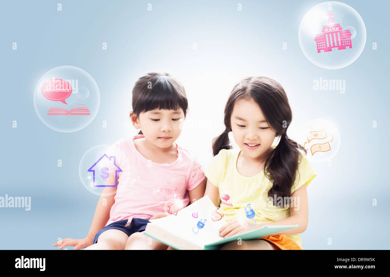 kids reading a book together Stock Photo - Alamy