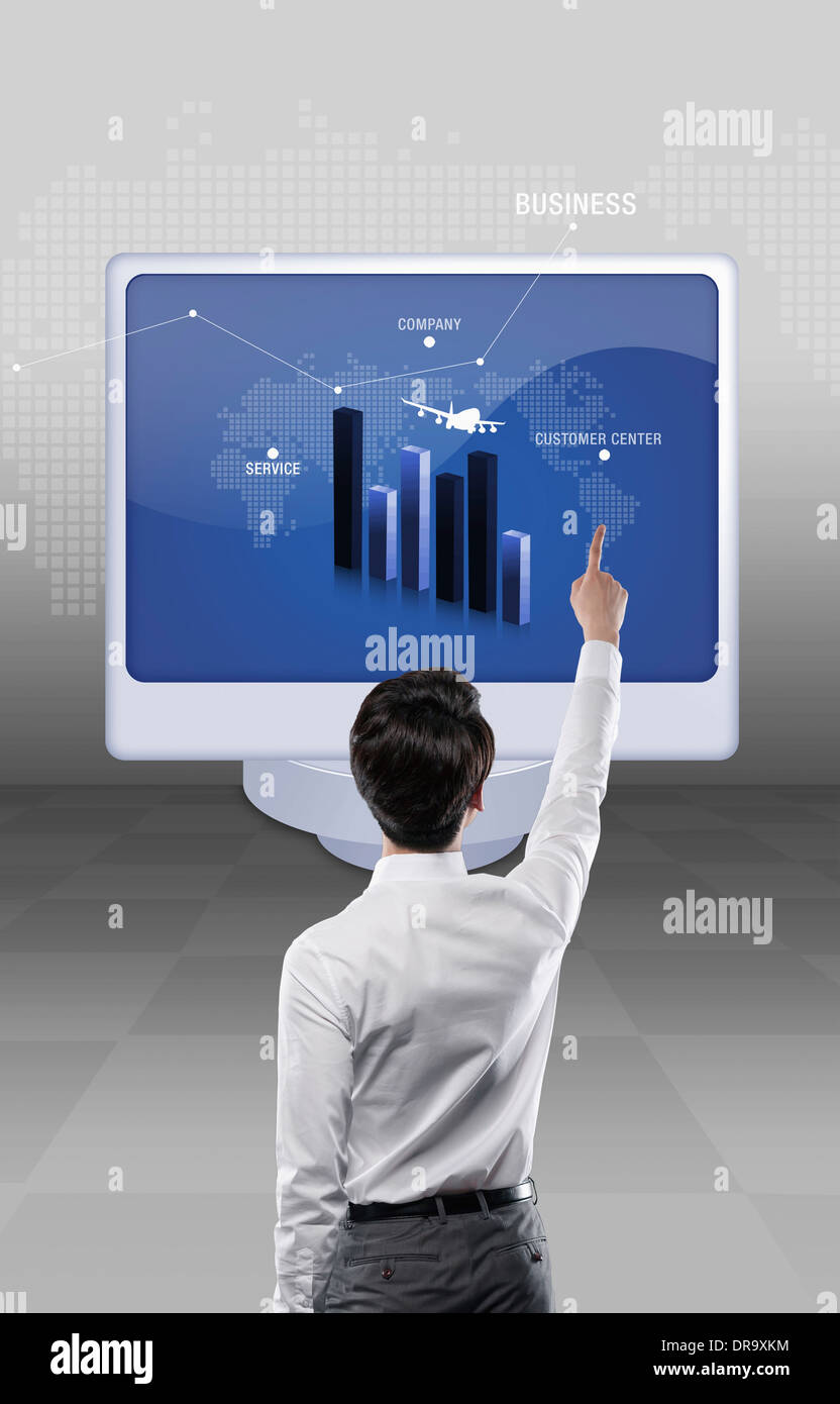 a businessman pointing at computer screen Stock Photo - Alamy
