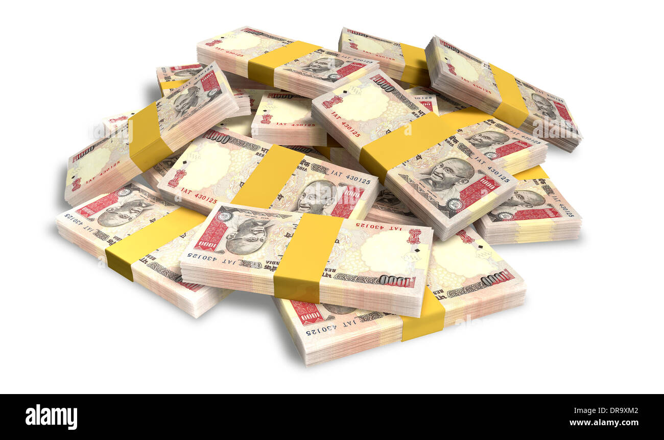 A pile of randomly scattered wads of indian rupee banknotes on an ...