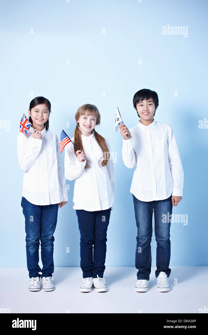 three kids holding different flags Stock Photo - Alamy