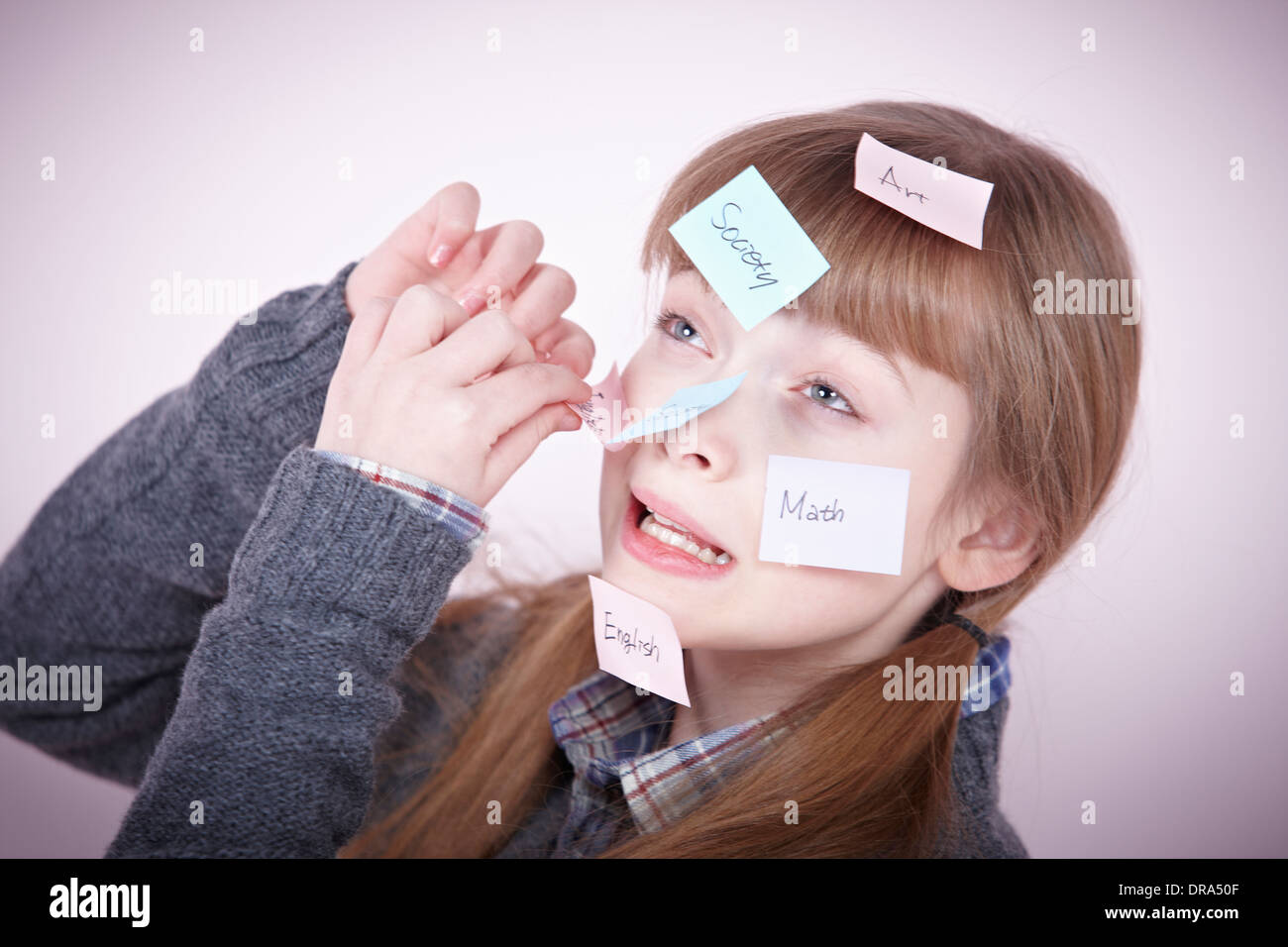 a girl with post-it notes all over her head Stock Photo - Alamy