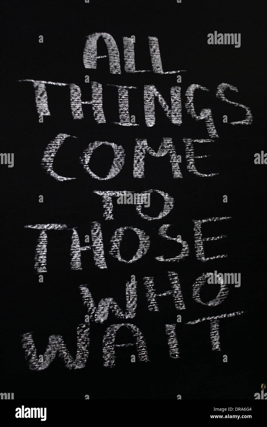 chalk writing - All things come to those that wait.- words written on ...