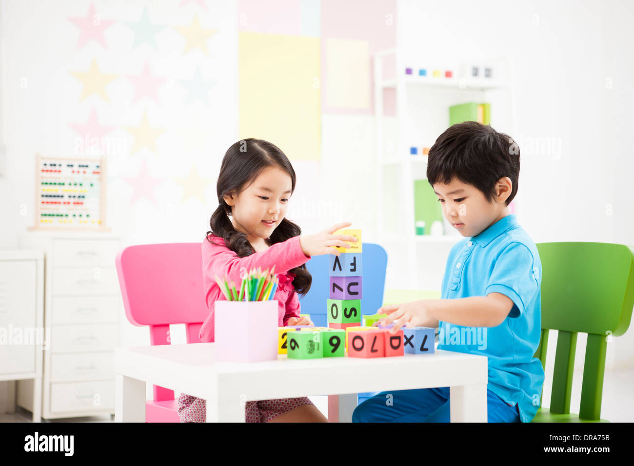 Boy girl playing cubes hi-res stock photography and images - Alamy