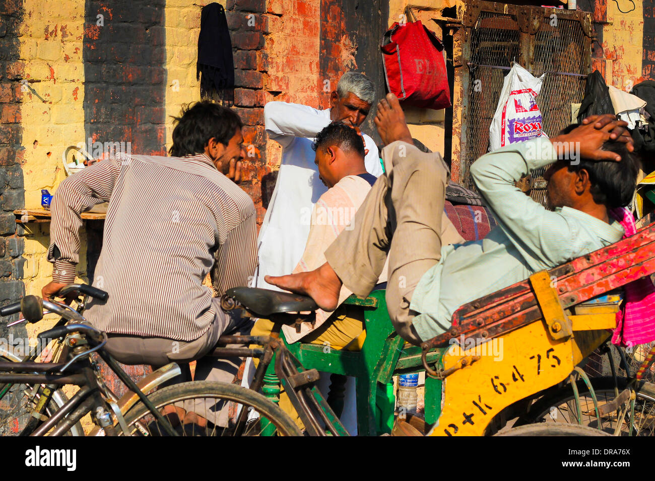 Man having haircut outdoors Stock Photo - Alamy