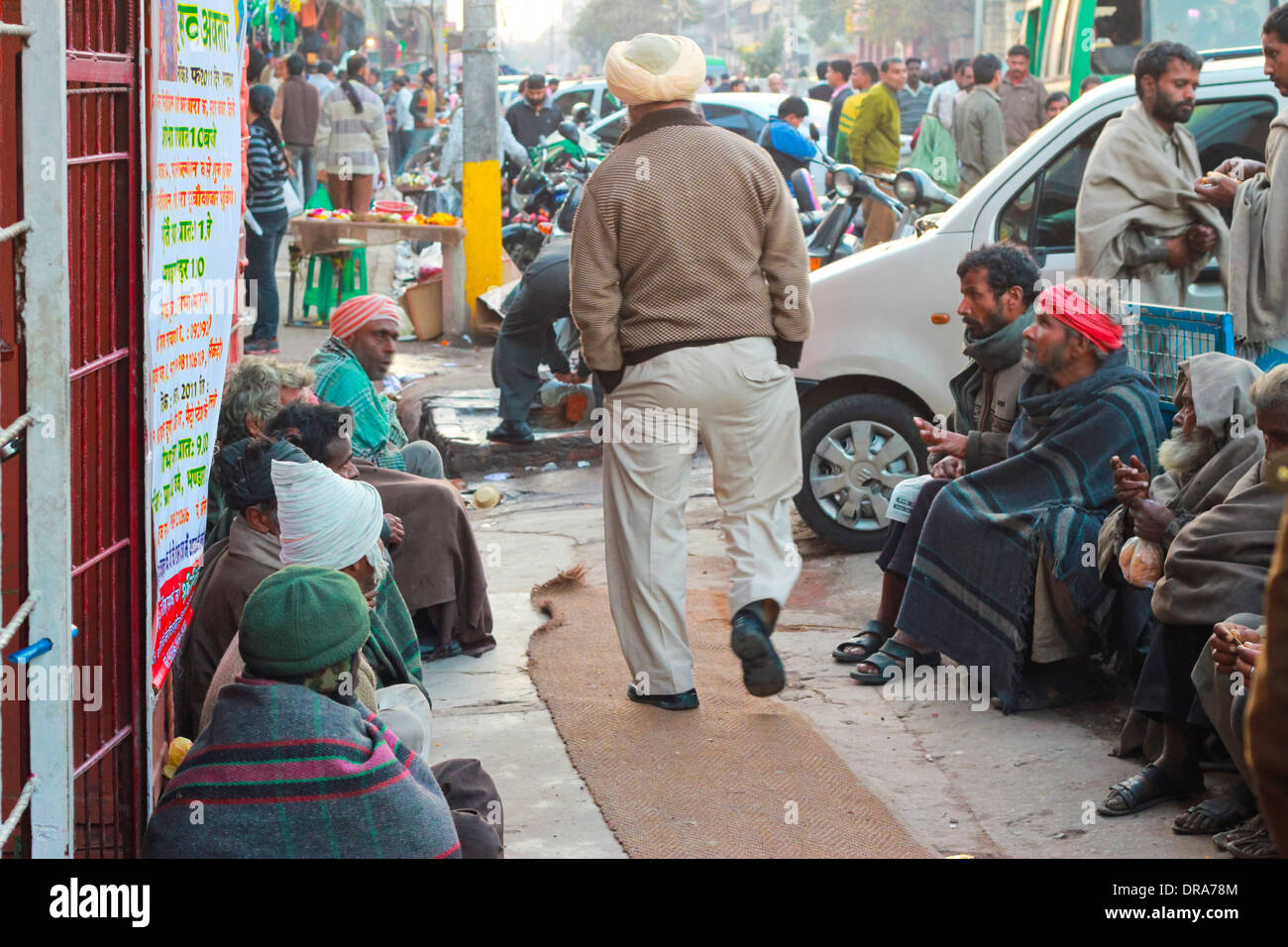 Beggars sitting on street Stock Photo - Alamy