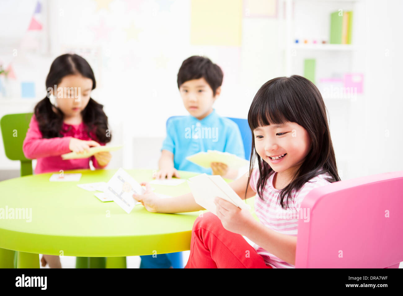 kids learning with toys at table Stock Photo - Alamy