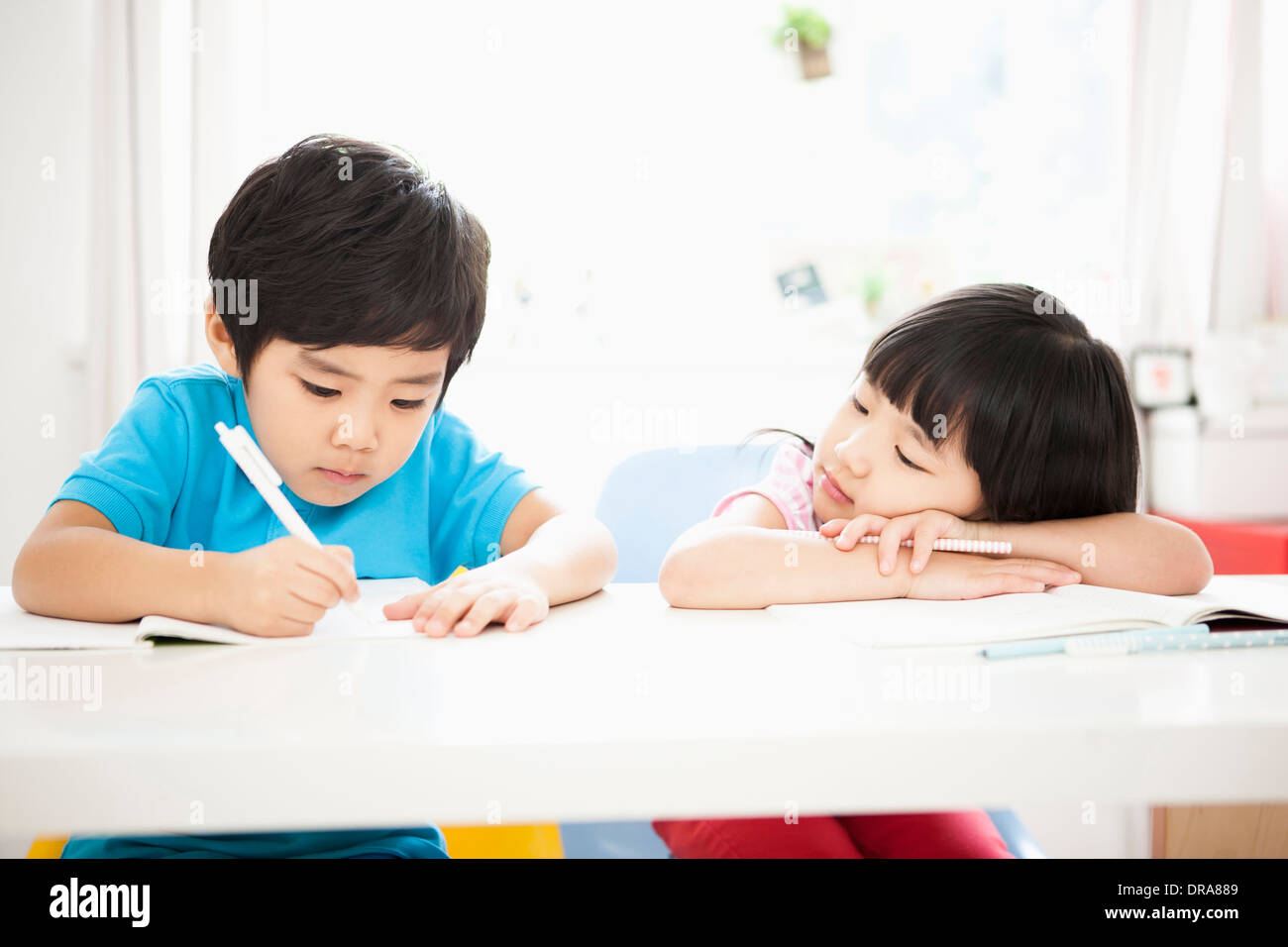 The child is lying on the desk hi-res stock photography and images - Alamy