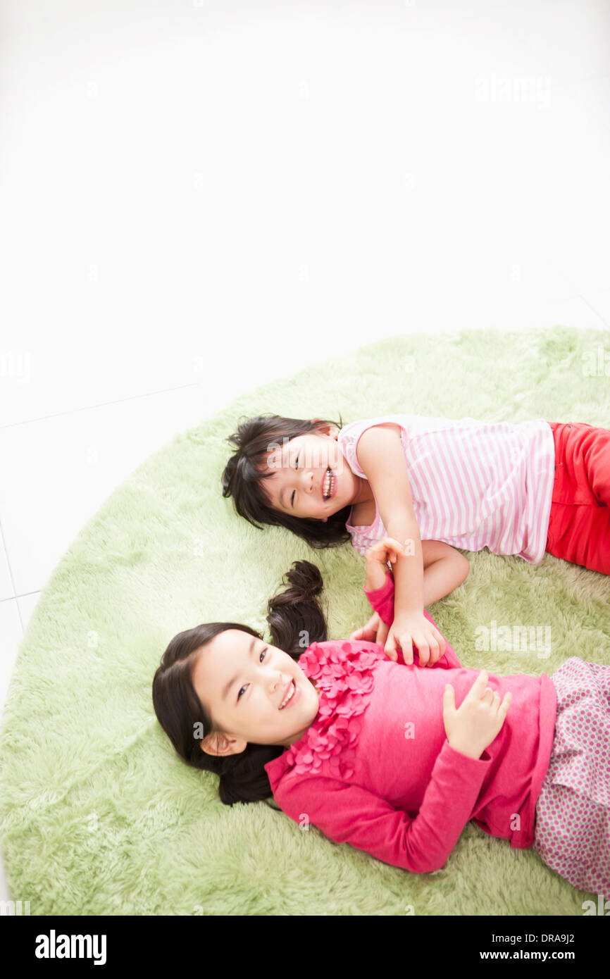 Two kids lying down on hi-res stock photography and images - Alamy