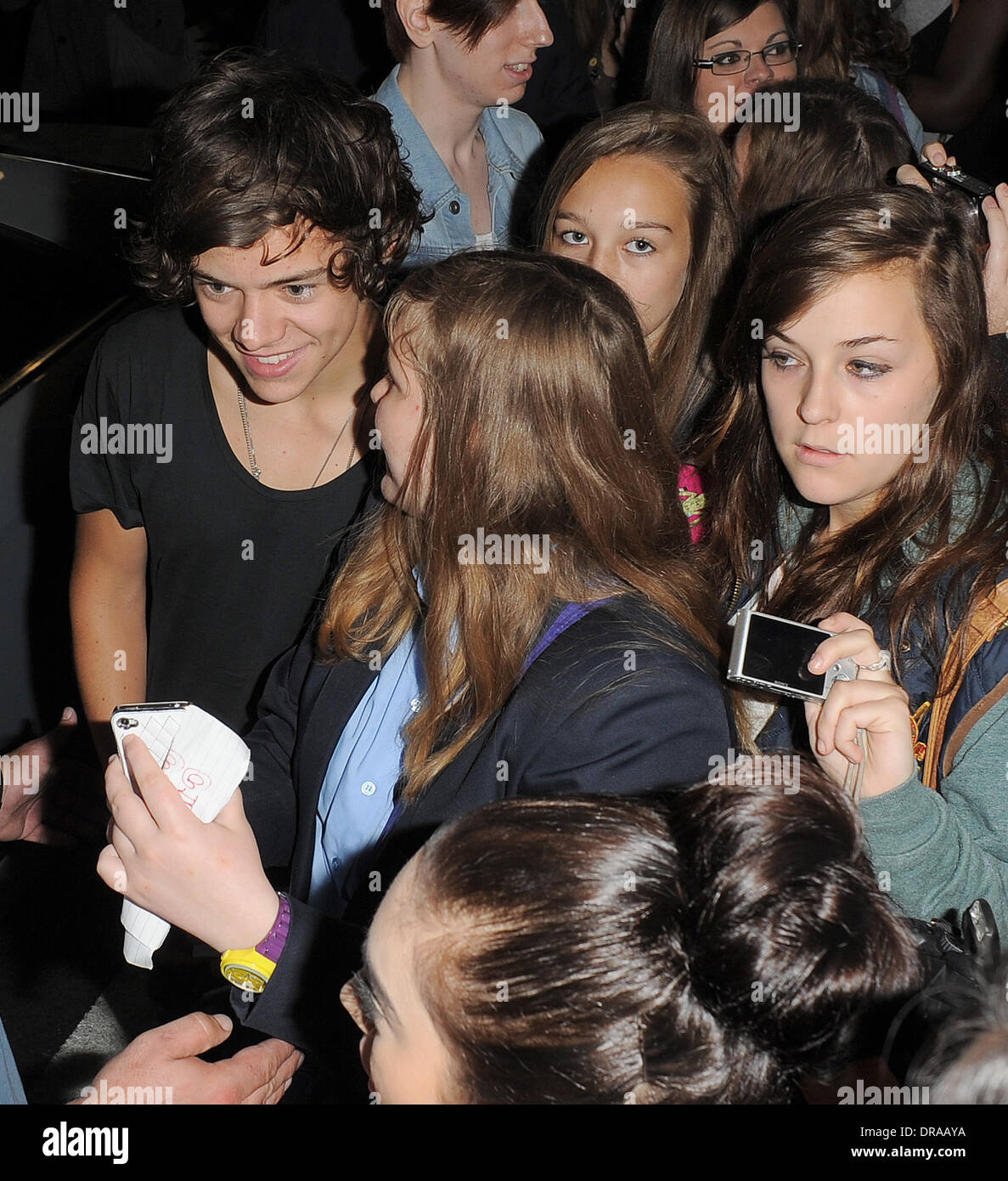 Harry Styles from boyband One Direction, arrives back home to England ...