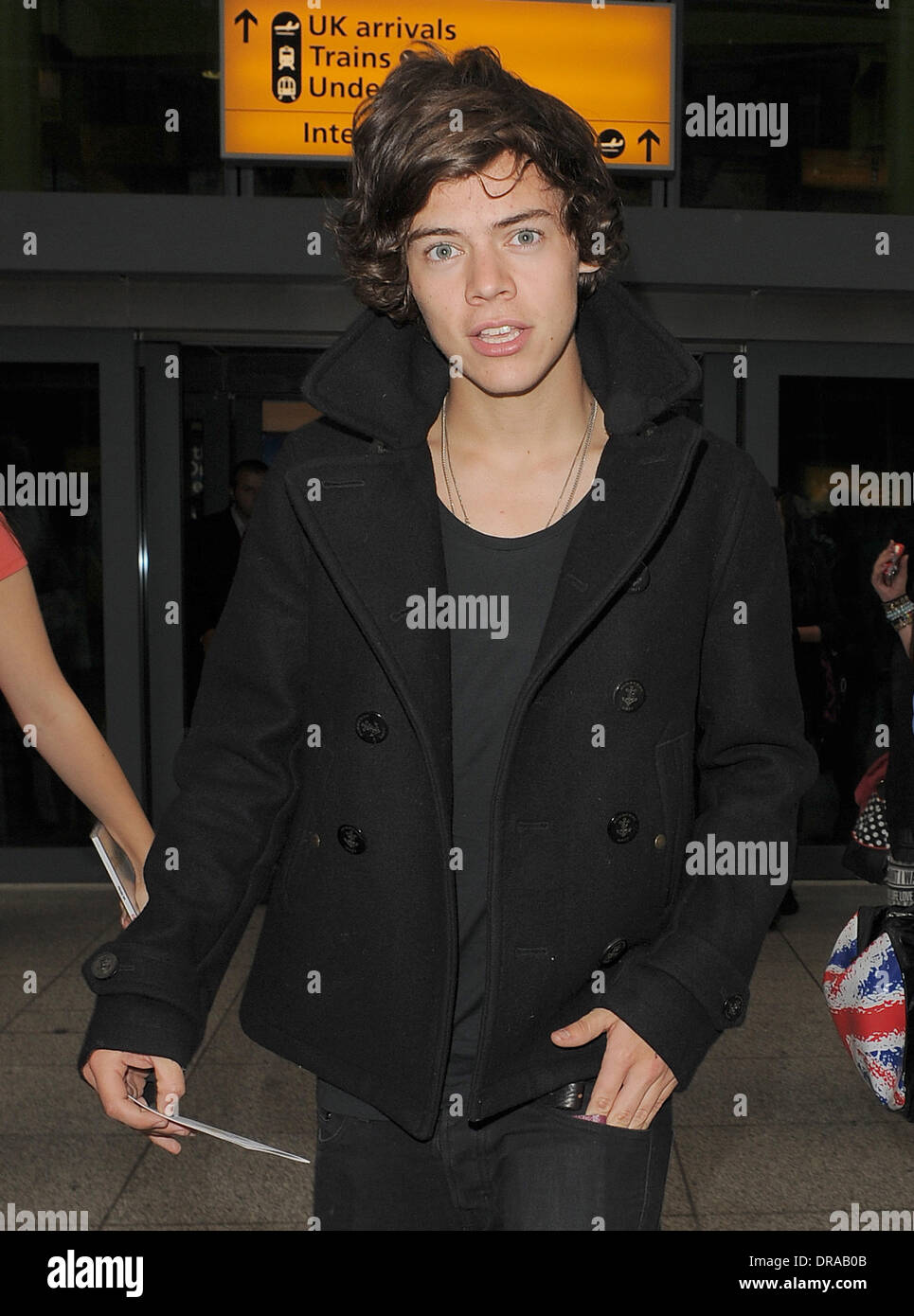Harry Styles from boyband One Direction, arrives back home to England ...