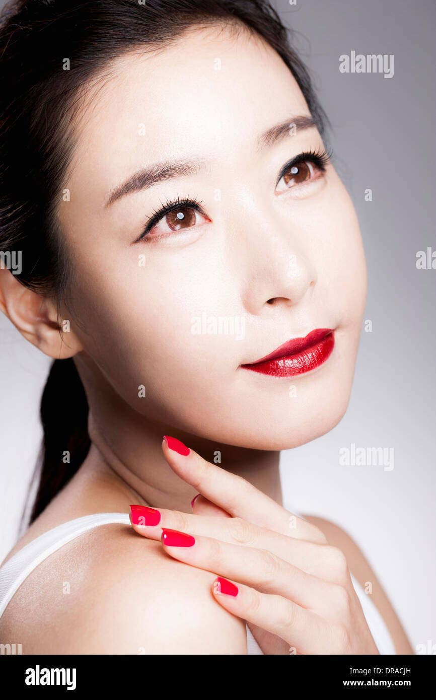 close up shot of a woman in red lipsticks and white top Stock Photo - Alamy