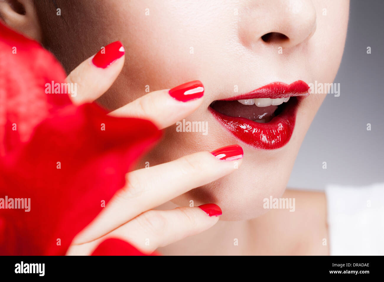 Close up red nails lips hi-res stock photography and images - Alamy
