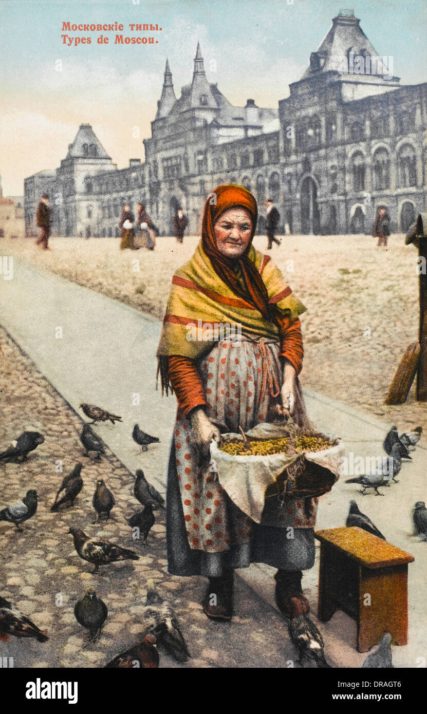 Russian woman feeding pigeons Stock Photo - Alamy