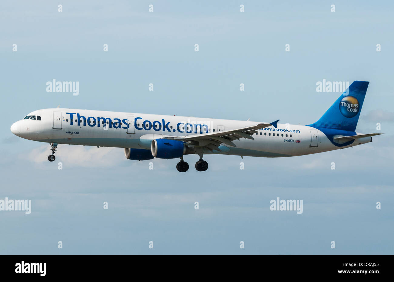 Thomas Cook Airbus A321 aircraft with landing gear down ready to land ...