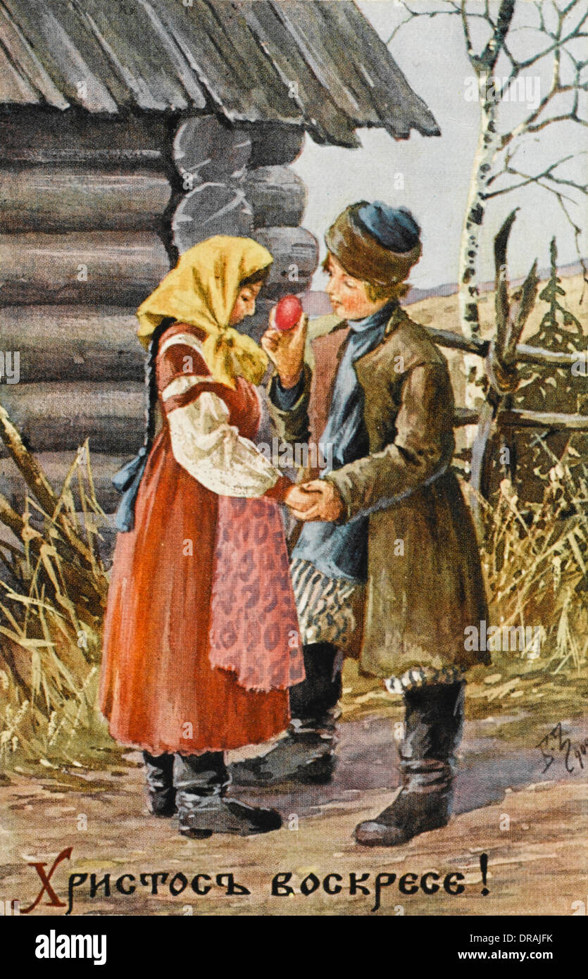 Russian peasant couple with an Easter egg Stock Photo - Alamy