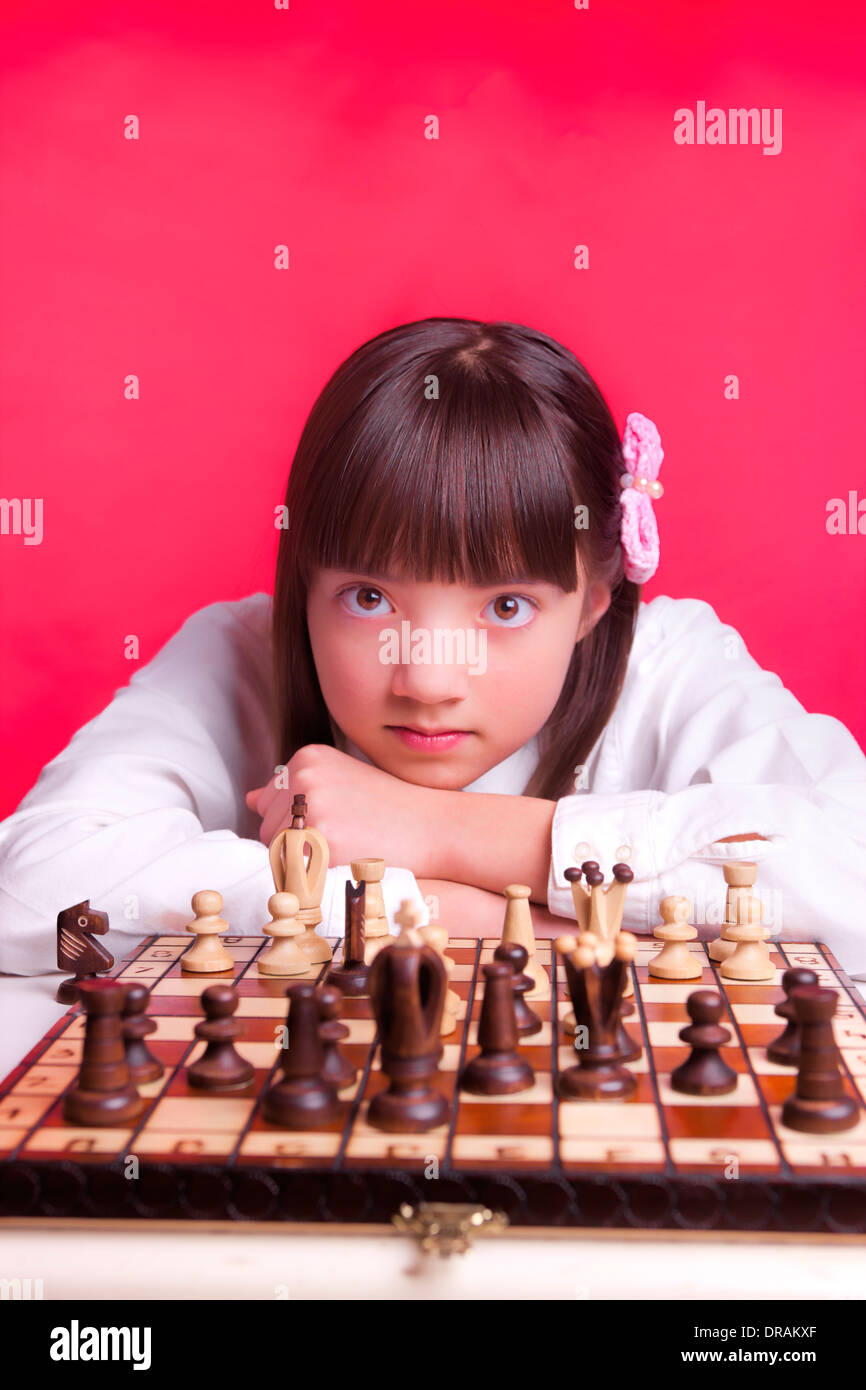 Girl relaxes during chess Stock Photo - Alamy